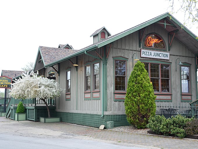 Pizza Junction's charming cottage-like exterior hints at comfort food served with a side of nostalgia in a setting that feels like coming home.