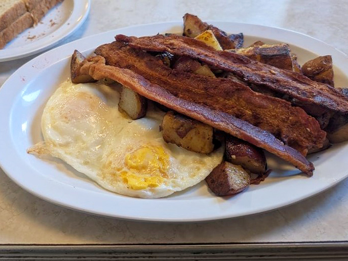 Eggs, bacon, and potatoes&mdash;the holy trinity of breakfast, executed with the reverence it deserves.