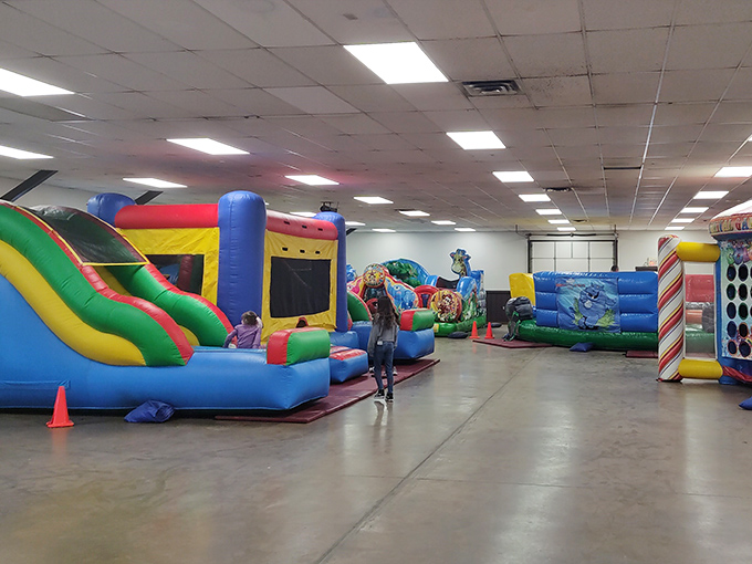 The bounce house area where parents discover the true meaning of "energy that could power a small city" while kids live their best lives.