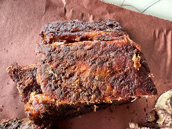 These spare ribs have that mahogany crust that makes barbecue fanatics weak in the knees. Smoke ring perfection.