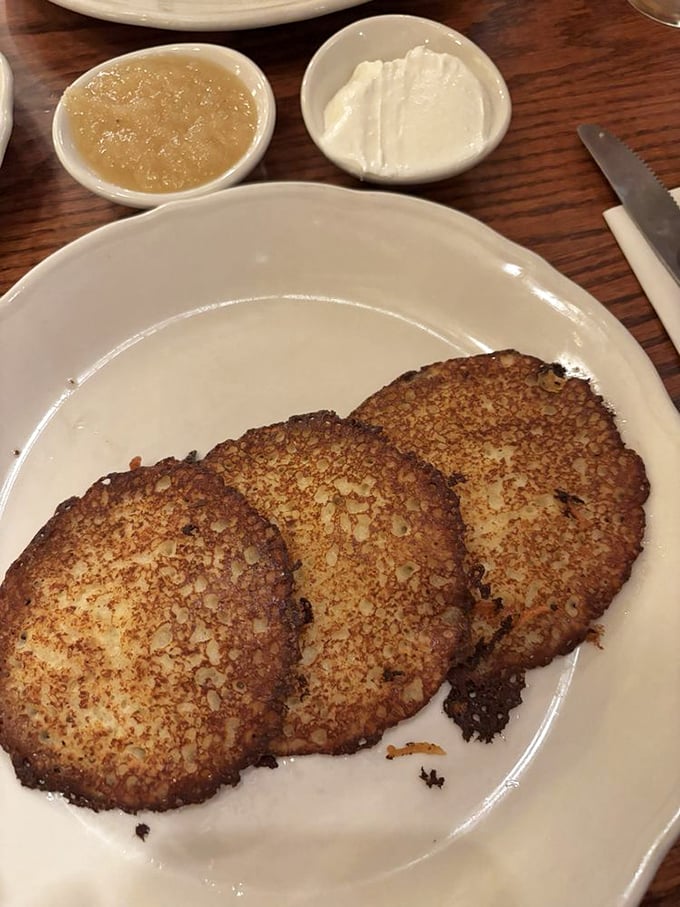 Potato pancakes with the perfect crispy exterior &ndash; served with traditional applesauce and sour cream for a breakfast that spans continents.