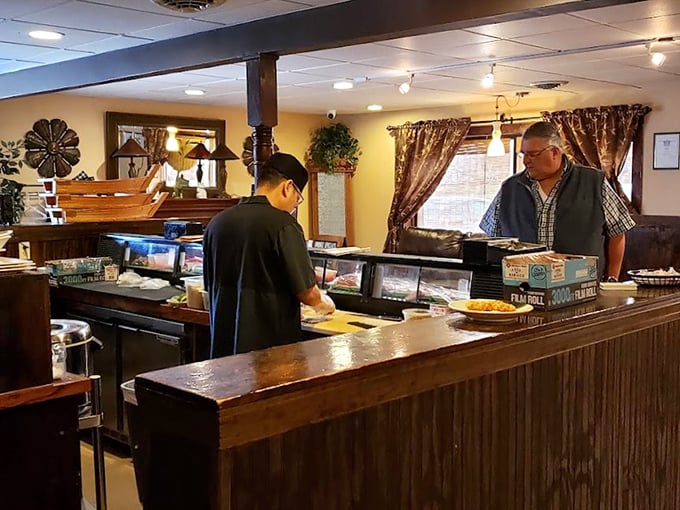 The preparation area reveals the restaurant's commitment to freshness &ndash; where seafood meets its destiny at the hands of trained professionals.