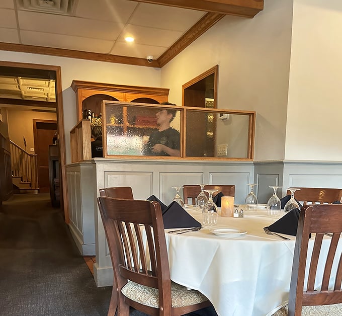 This intimate dining area offers the perfect balance of privacy and pampering &ndash; like dining in someone's very elegant home.