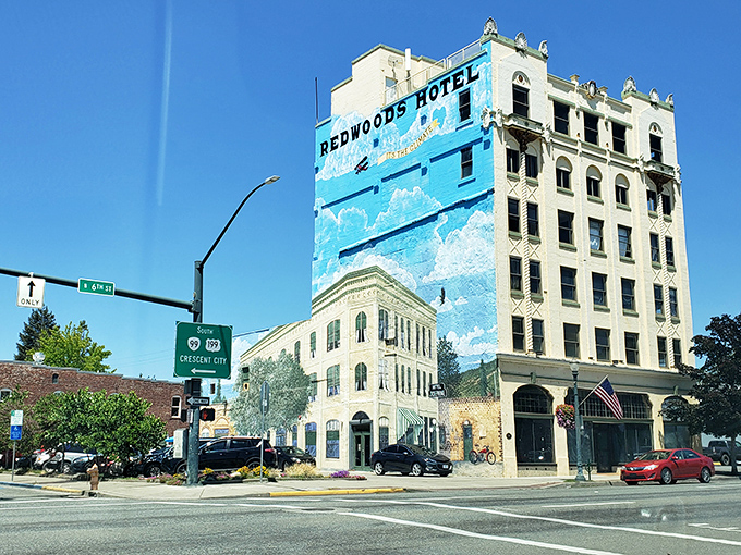 The historic Redwoods Hotel stands as downtown's crown jewel, its mural reaching skyward like the ambitions of the town itself.