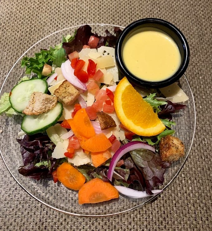 Even the salad gets special treatment at Saskatoon. Fresh, colorful, and thoughtfully composed&mdash;the perfect prelude to wilderness cuisine.