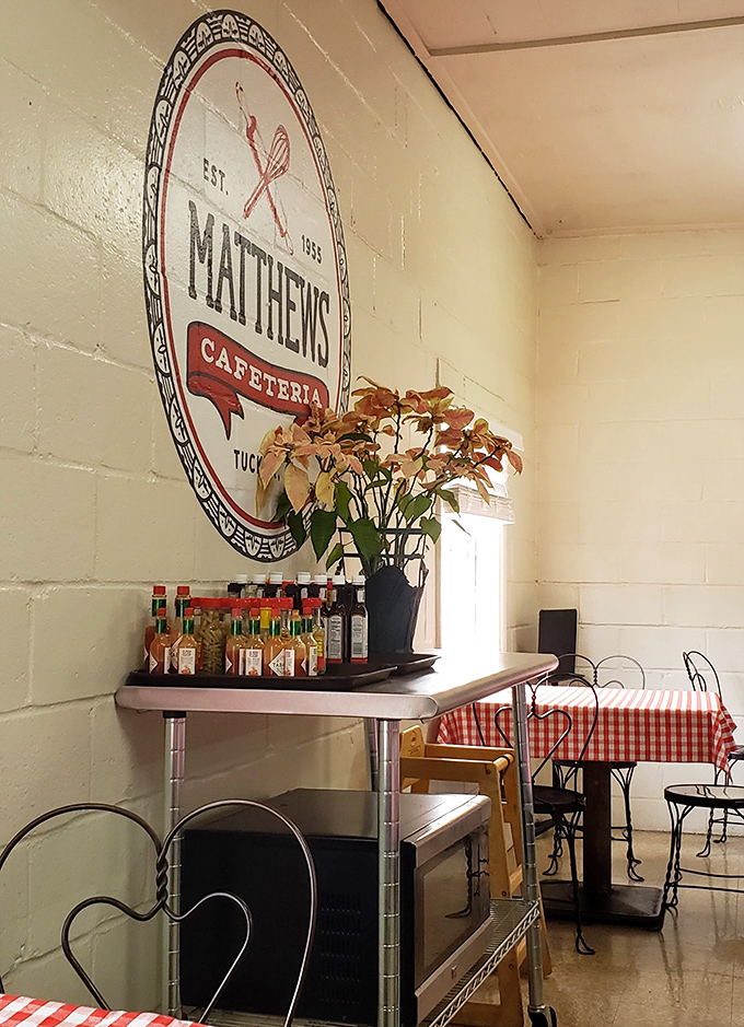 The Matthews logo watches over diners like a benevolent spirit, promising that some things in this world remain deliciously constant.