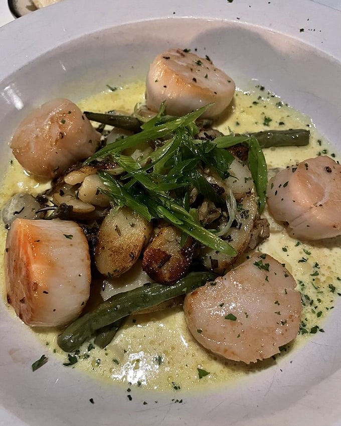 Scallops swimming in buttery bliss with seasonal vegetables. The ocean and garden having a delicious conversation on your plate.
