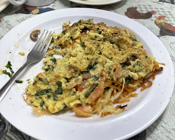 A veggie scramble that makes eating greens before noon feel like cheating the system. Those bits of color are vitamins disguised as deliciousness.
