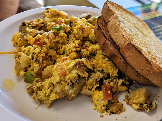 Scrambled eggs so fluffy they could double as clouds, served with toast that actually tastes like bread should.