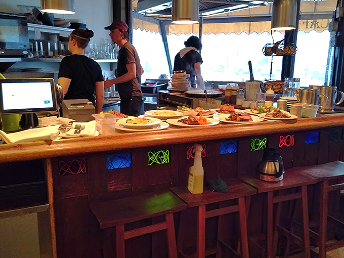 Where culinary magic happens before reaching your table. Those plates waiting in line look like they're auditioning for their big moment.