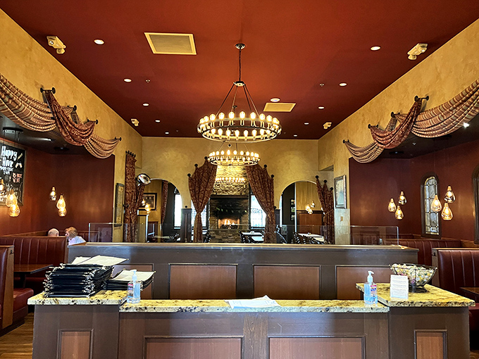 The host station welcomes you like an old friend, with warm wood tones and the promise of Italian hospitality just steps away.