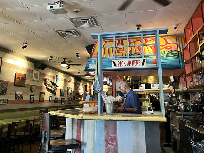 The "Pick Up Here" sign might as well say "Happiness Distribution Center" for the lucky souls collecting their takeout treasures.