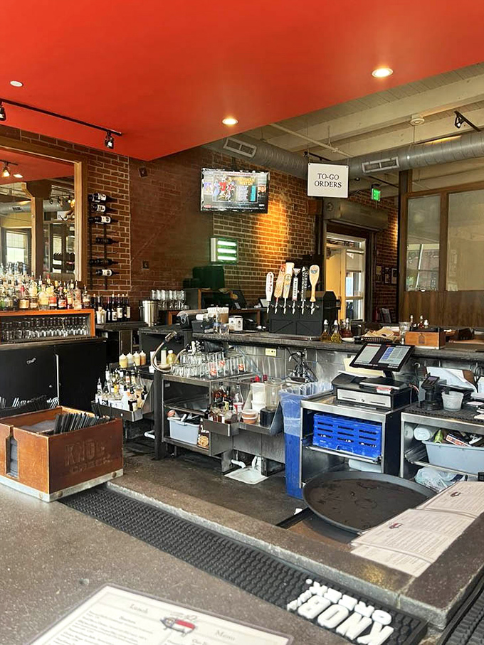 The bar area stands ready for those wise enough to enjoy a local brew while waiting for their barbecue&mdash;patience tastes better with a pint.