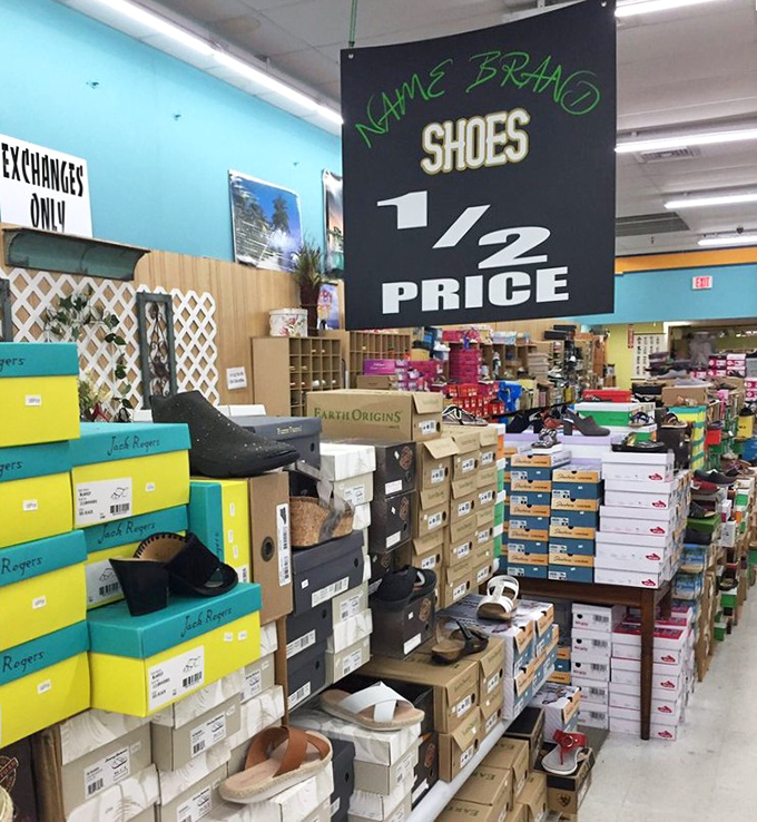 Half-price footwear heaven stacked to the ceiling. The shoe section where your wallet breathes easy while your feet get fancy.