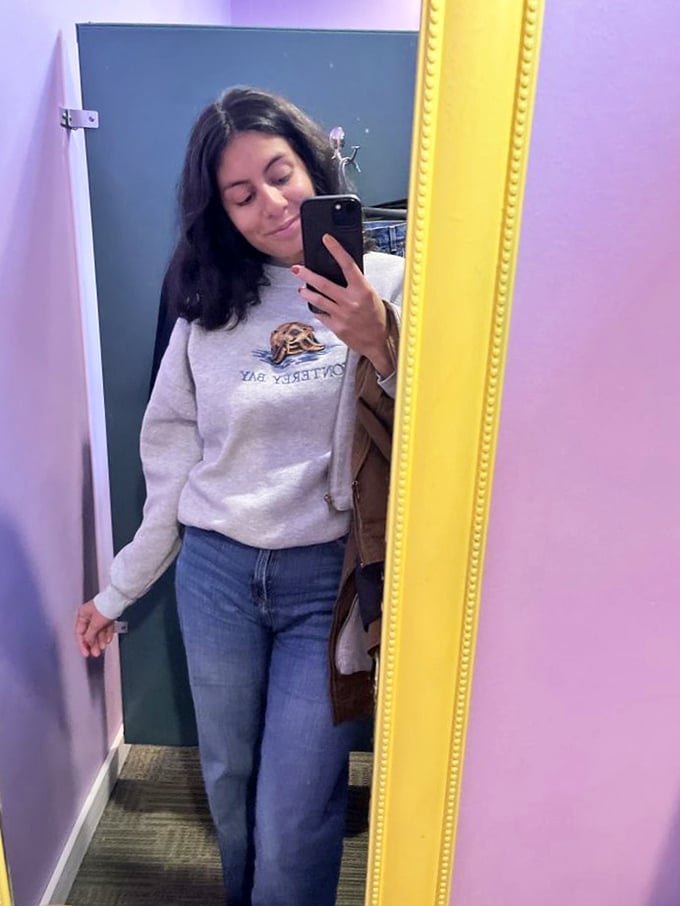 Another happy hunter emerges victorious, arms full of finds that would make any bargain-lover jealous.