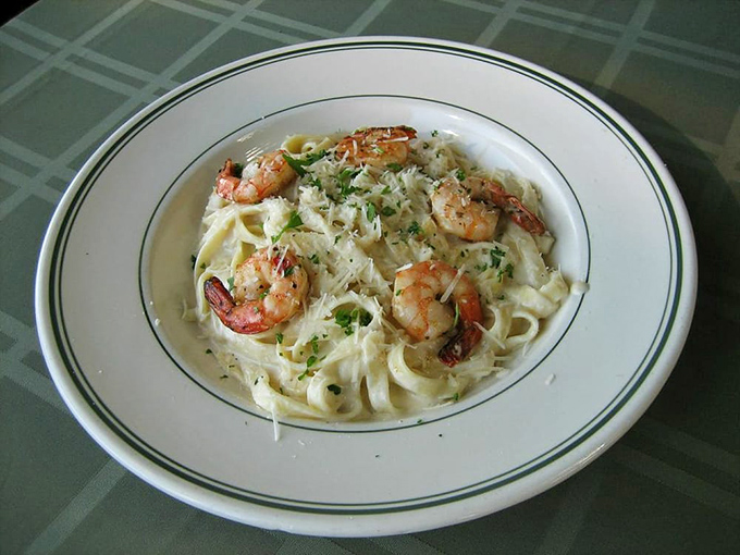Fettuccine alfredo where plump shrimp play hide-and-seek in a creamy sauce that clings lovingly to each strand of pasta.