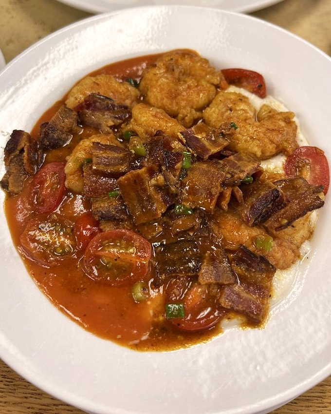 Shrimp and grits elevated to an art form. Those tomatoes and bacon are playing backup singers to the star of the show.