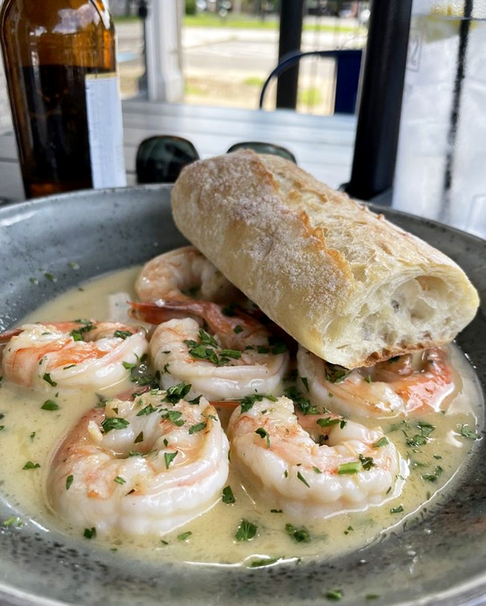 Shrimp scampi that's practically swimming to your mouth. That baguette isn't just bread &ndash; it's your ticket to capturing every drop of that heavenly sauce.