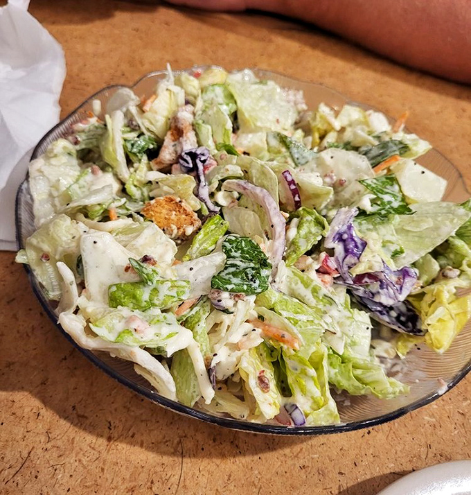 A house salad that somehow makes vegetables exciting. The perfect opening act before the main event, or a noble attempt at dietary virtue.