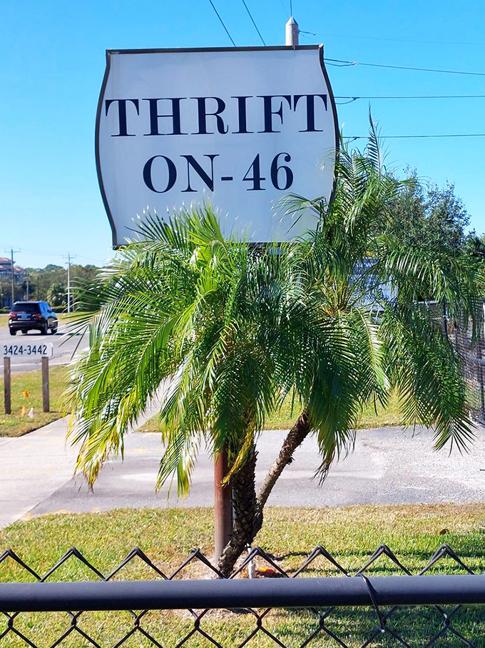 The roadside sign stands as a beacon to bargain hunters, promising adventures in secondhand shopping just beyond the palm trees.