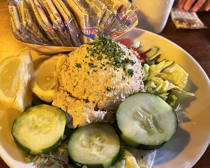 Smoked tuna dip surrounded by fresh veggies and crackers – the appetizer that disappears so quickly you'll wonder if someone else at the table has a secret extra hand.