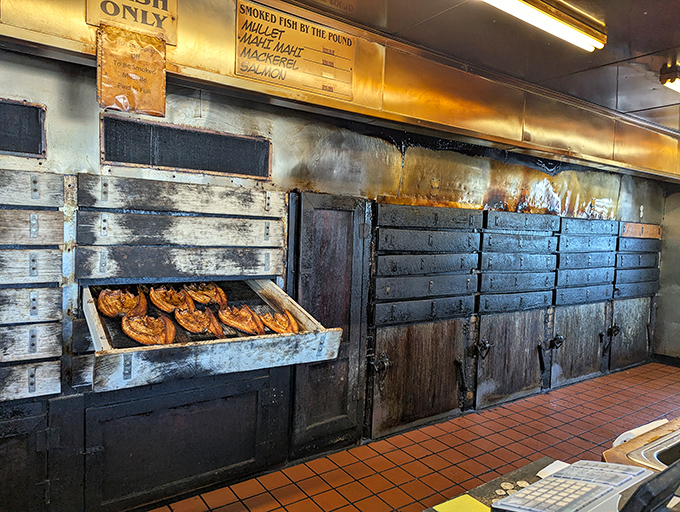 The smoking chambers where magic happens. These weathered wooden boxes have probably smoked more fish than most of us have had hot dinners. 