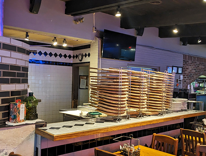 Those stacked pizza rounds aren't just dough&mdash;they're potential happiness discs waiting for their moment in the fiery spotlight. Pizza anticipation at its finest.
