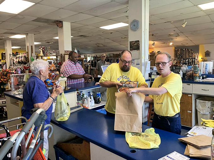 The unsung heroes of thrift! Encore's yellow-shirted staff doesn't just ring up your treasures&mdash;they're the curators of this museum of affordable possibilities.