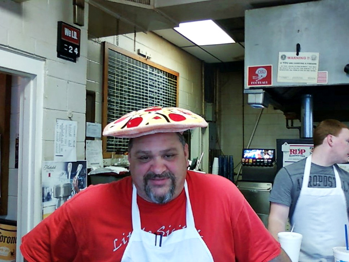 Behind every great neighborhood pizzeria is someone who treats dough like an art form. That pizza hat isn't just fun&mdash;it's truth in advertising.