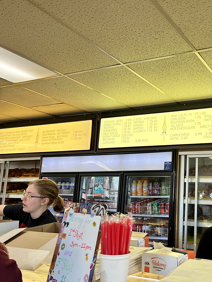 The illuminated menu boards glow like beacons of hope, guiding hungry patrons toward their perfect donut match.