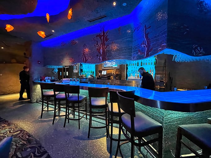 The bar area at night transforms into an electric blue grotto. Even the most mundane gin and tonic feels exotic in this setting.