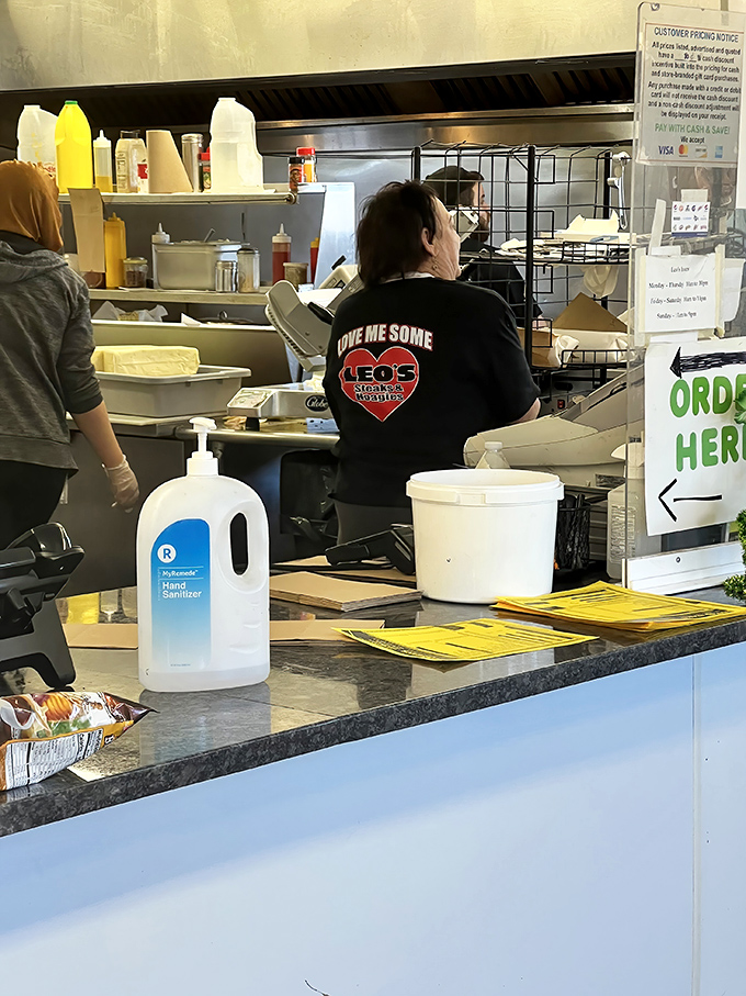 Behind the counter, where sandwich dreams become reality. "Give Me Some Leo's Steaks" isn't just a shirt &ndash; it's a philosophy of life.
