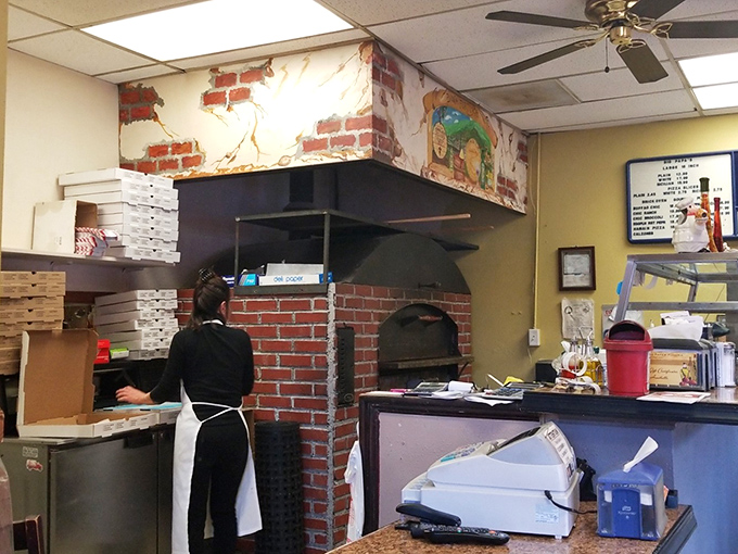 Behind every great pizza is a brick oven and the hands that know exactly how to use it. This is where the magic happens.