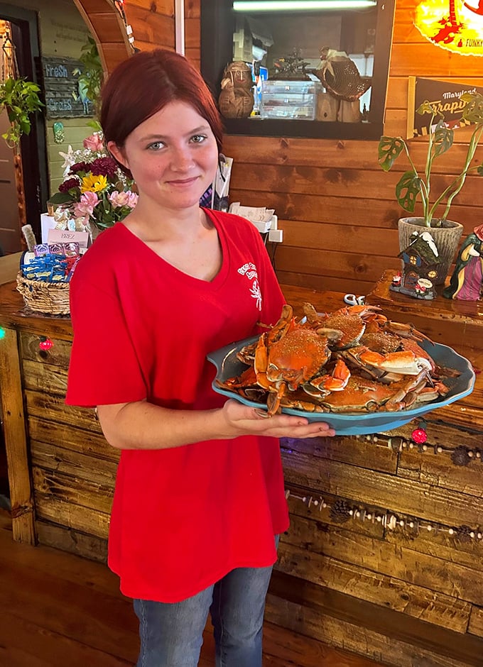The smile says it all: "Yes, these crabs are as good as they look." Blue crab ambassadors don't need fancy uniforms&mdash;just the freshest catch.