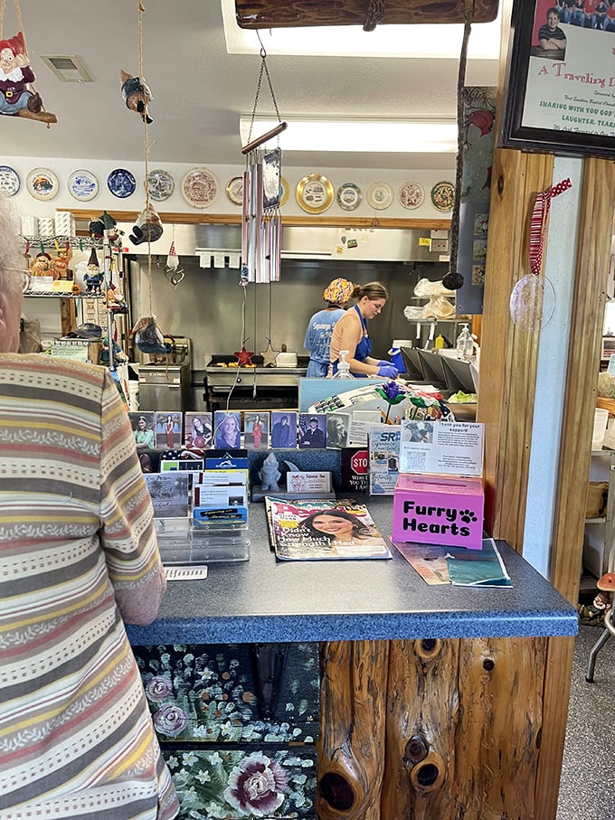 Behind every great burger joint is a dedicated staff. The gnome collection watching over the counter adds whimsy to the serious business of burger-making.