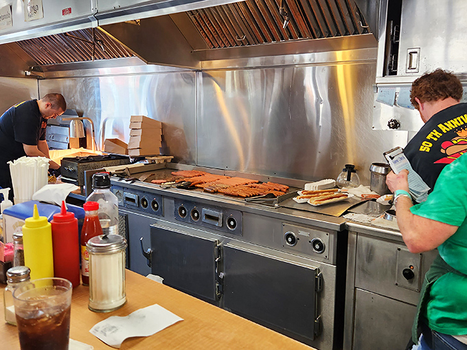 Skilled hands at work on the grill. There's a choreography to short-order cooking that rivals any ballet.