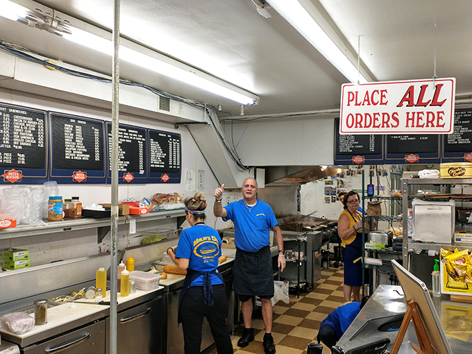 Behind every great sandwich is a team that knows exactly what they're doing. The kitchen choreography here has been perfected over countless lunch rushes.