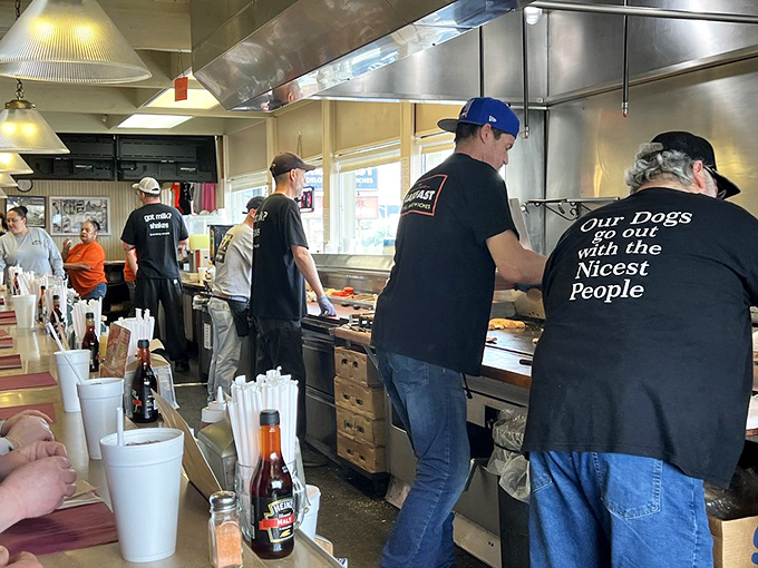 The staff works with the choreographed precision of people who've turned fast food into an art form. Note the perfect t-shirt philosophy. 