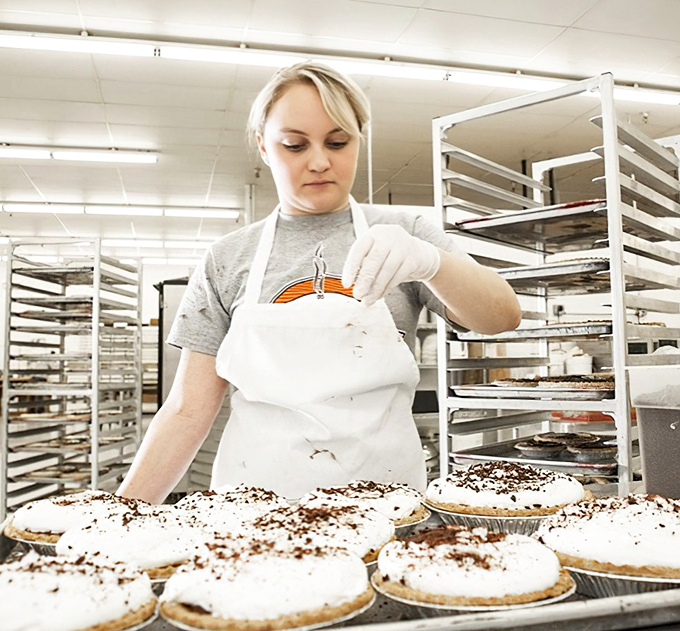 Craftsmanship in action&mdash;each pie receives the attention a Renaissance painting deserves. This is where magic happens, one whipped topping at a time.