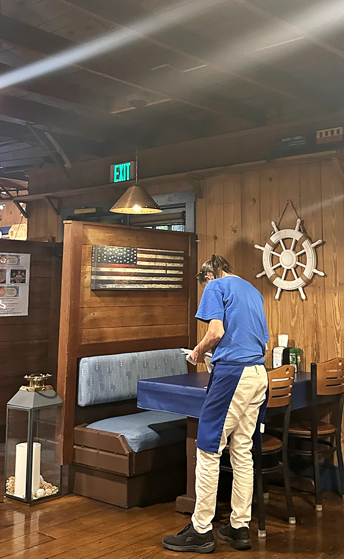 Every great seafood joint has its caretakers. The blue aprons signal you're in capable hands for your lobster roll journey.