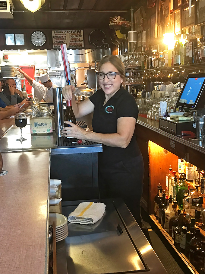The smile says it all - serving food this good must be the world's best job.