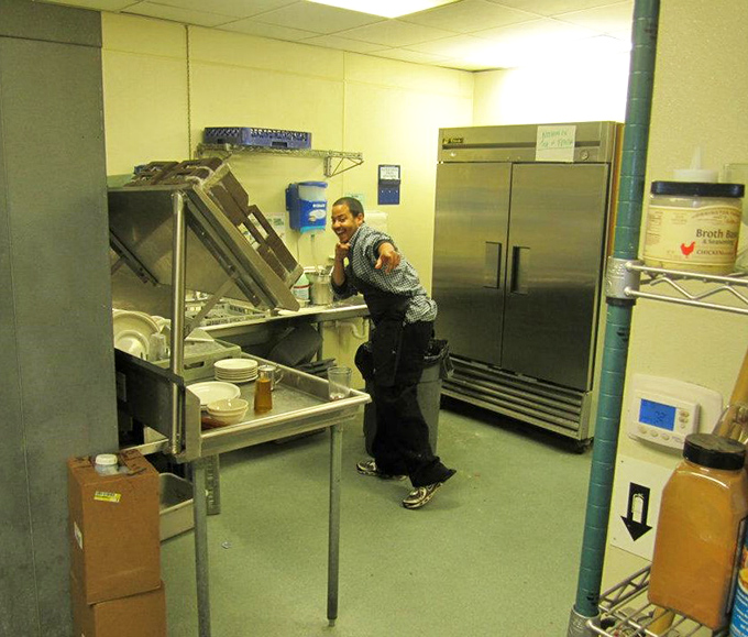 Behind every great diner dish is someone who knows their way around a kitchen. This candid moment captures the hustle that makes the magic happen.