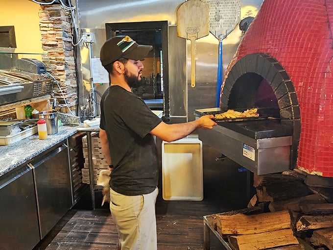 Behind every great pizza is someone wielding a paddle with the confidence of a maestro conducting a culinary symphony. 