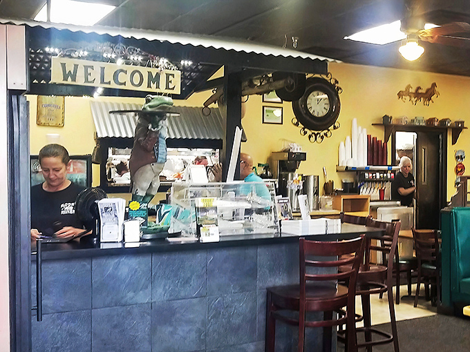 Where the magic happens – staff working behind the counter with the efficiency that comes from years of turning orders into memories.
