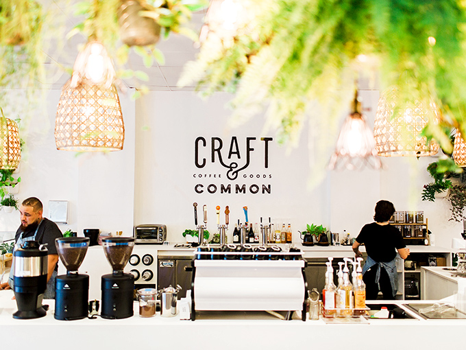 Baristas working their magic behind a pristine counter &ndash; where coffee science meets art in a laboratory of caffeinated dreams.