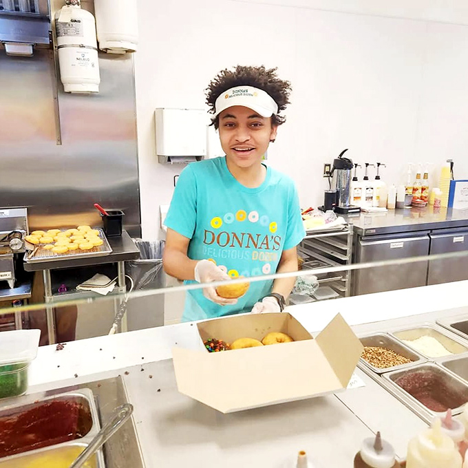 Behind every great donut is a dedicated team member, crafting each one with the care usually reserved for fine jewelry. 