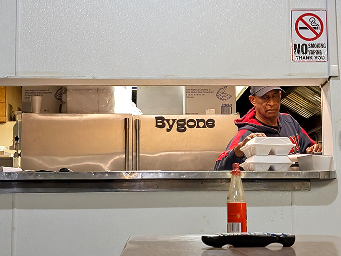 The kitchen pass becomes a portal where authentic Caribbean dishes make their final journey before changing someone's definition of delicious forever.