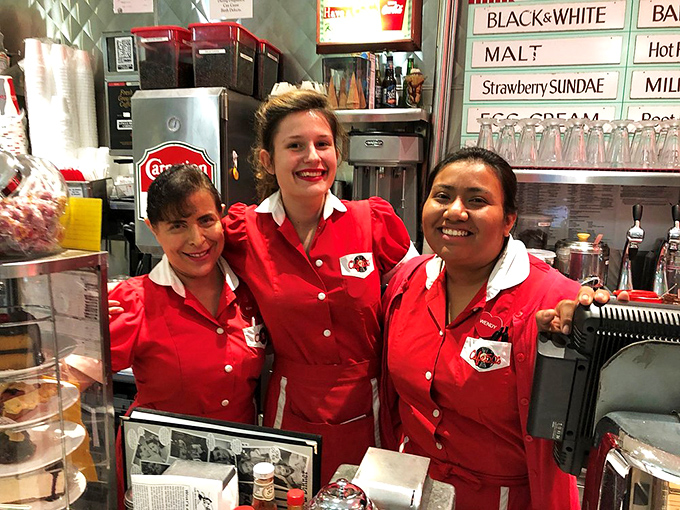The servers' smiles are as bright as their cherry-red uniforms. These are the faces that launch a thousand milkshakes daily.