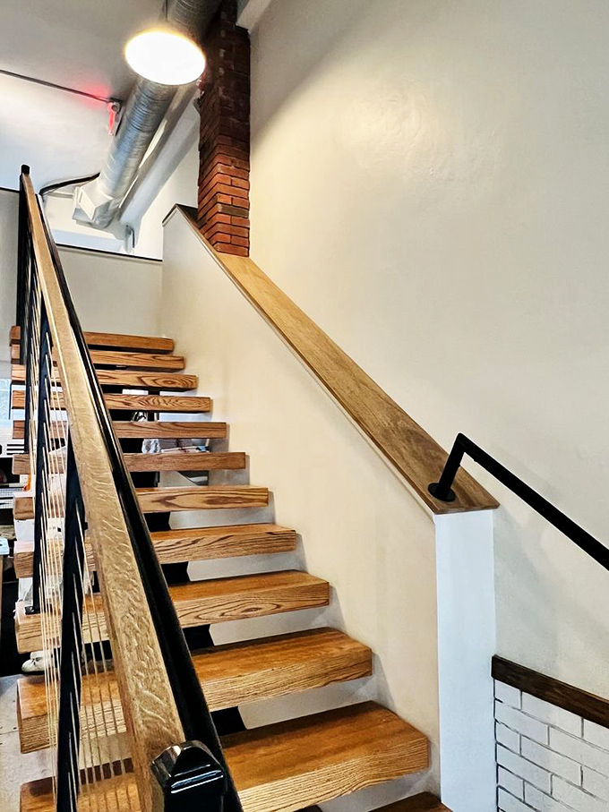 These wooden stairs don't just lead to a second floor—they're a stairway to pizza heaven, with industrial touches keeping things firmly grounded.