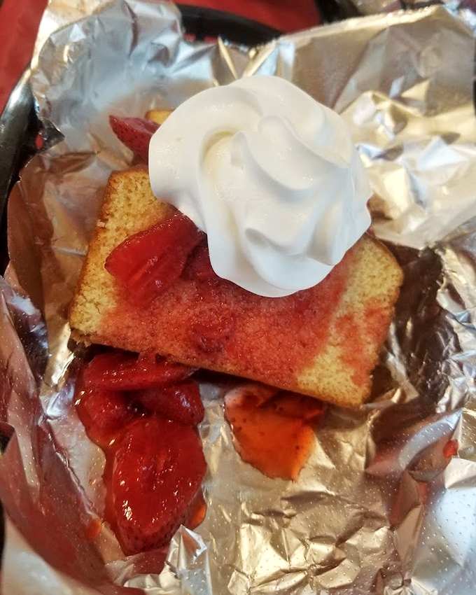 Strawberry shortcake that hits the sweet-tart balance perfectly. That dollop of whipped cream isn't just garnish—it's essential engineering.